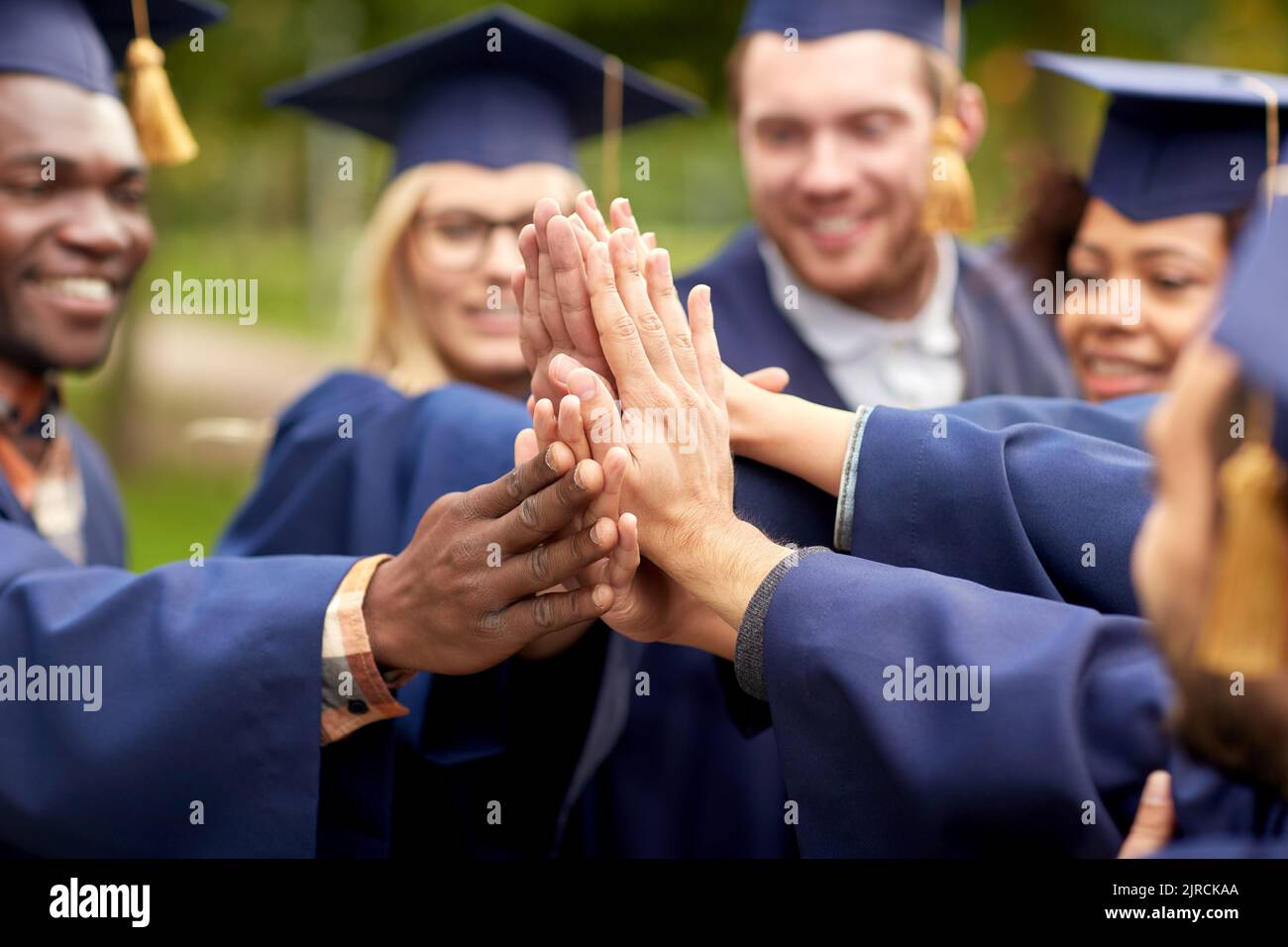 international graduate students making high five Stock Photo - Alamy