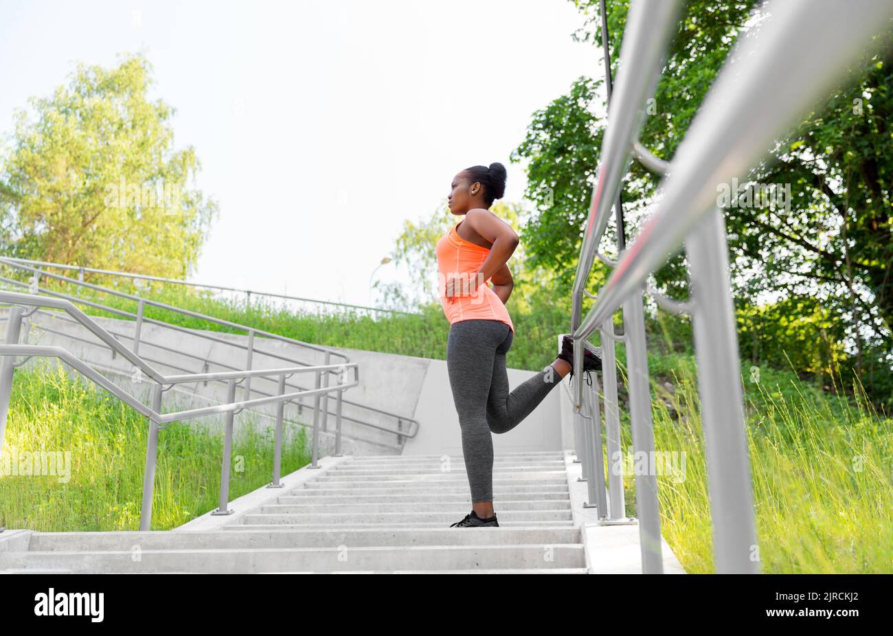 young african american woman stretching outdoors Stock Photo - Alamy