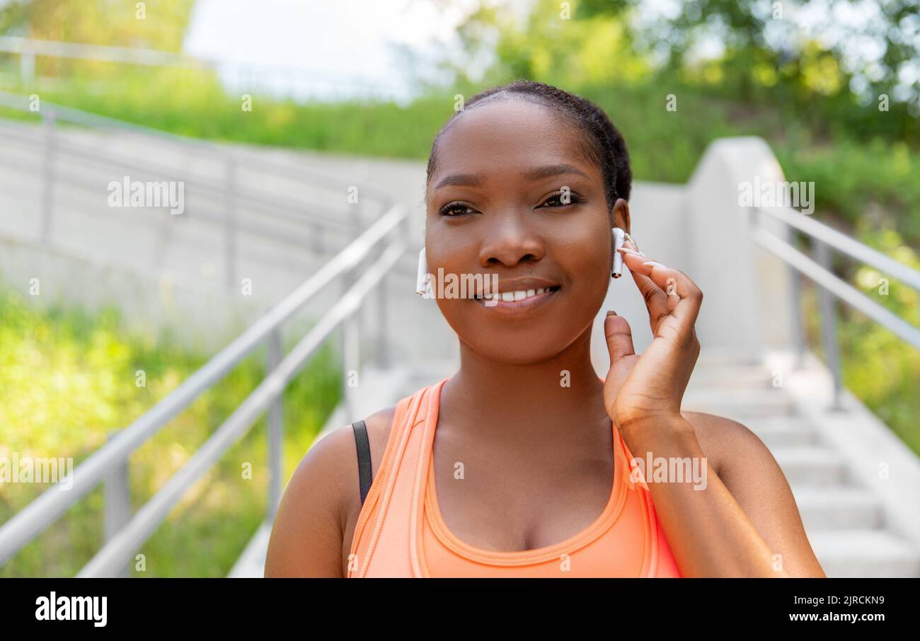 Woman earphones hi-res stock photography and images - Alamy