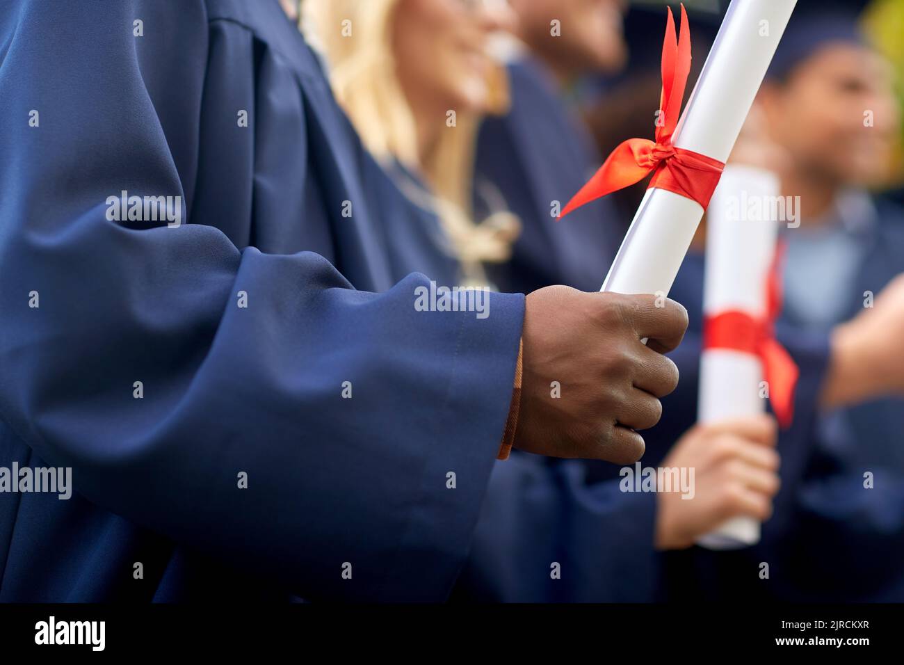 graduate students in mortar boards with diplomas Stock Photo - Alamy