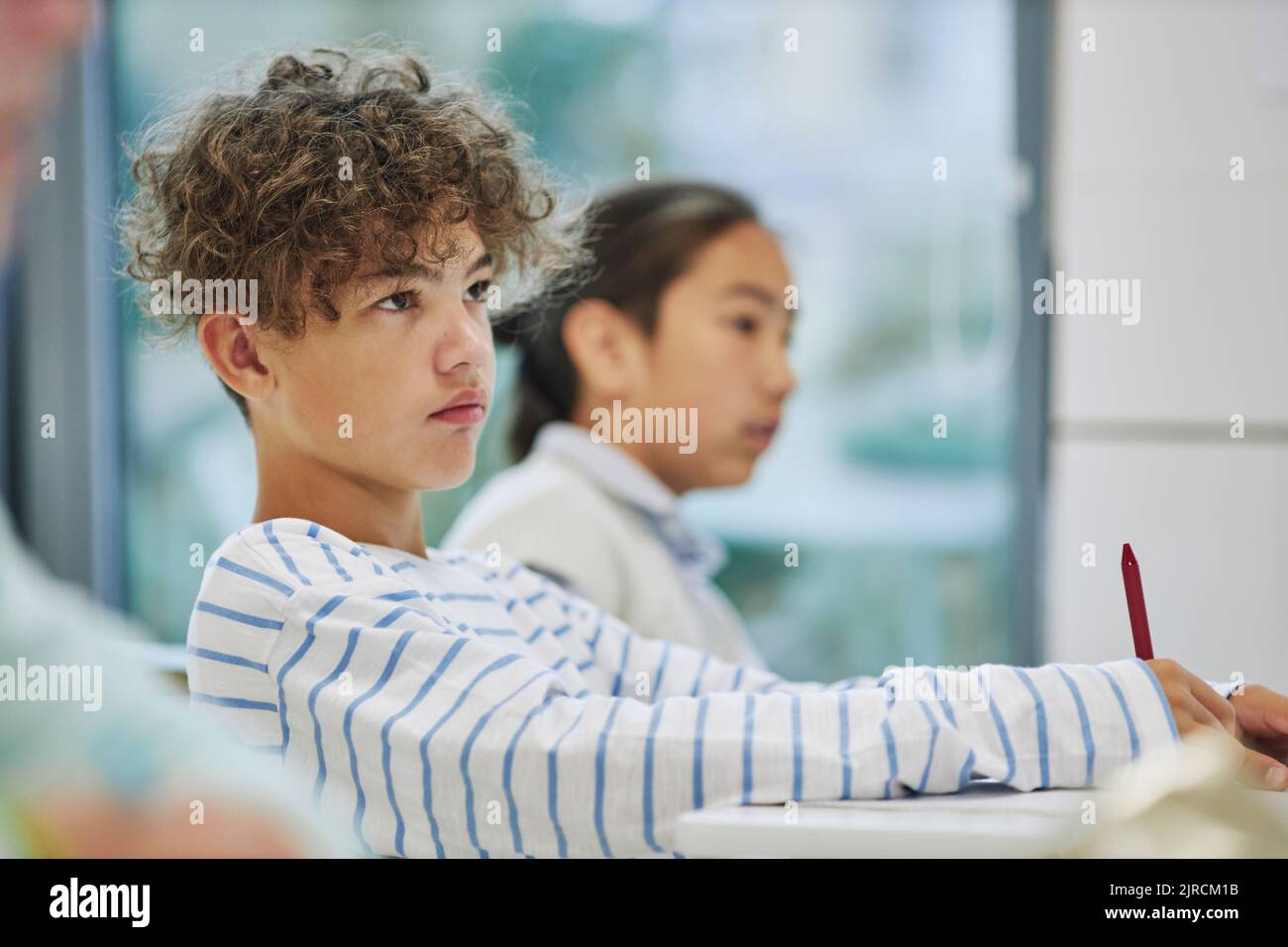 Teenage boy sitting back view hi-res stock photography and images - Alamy