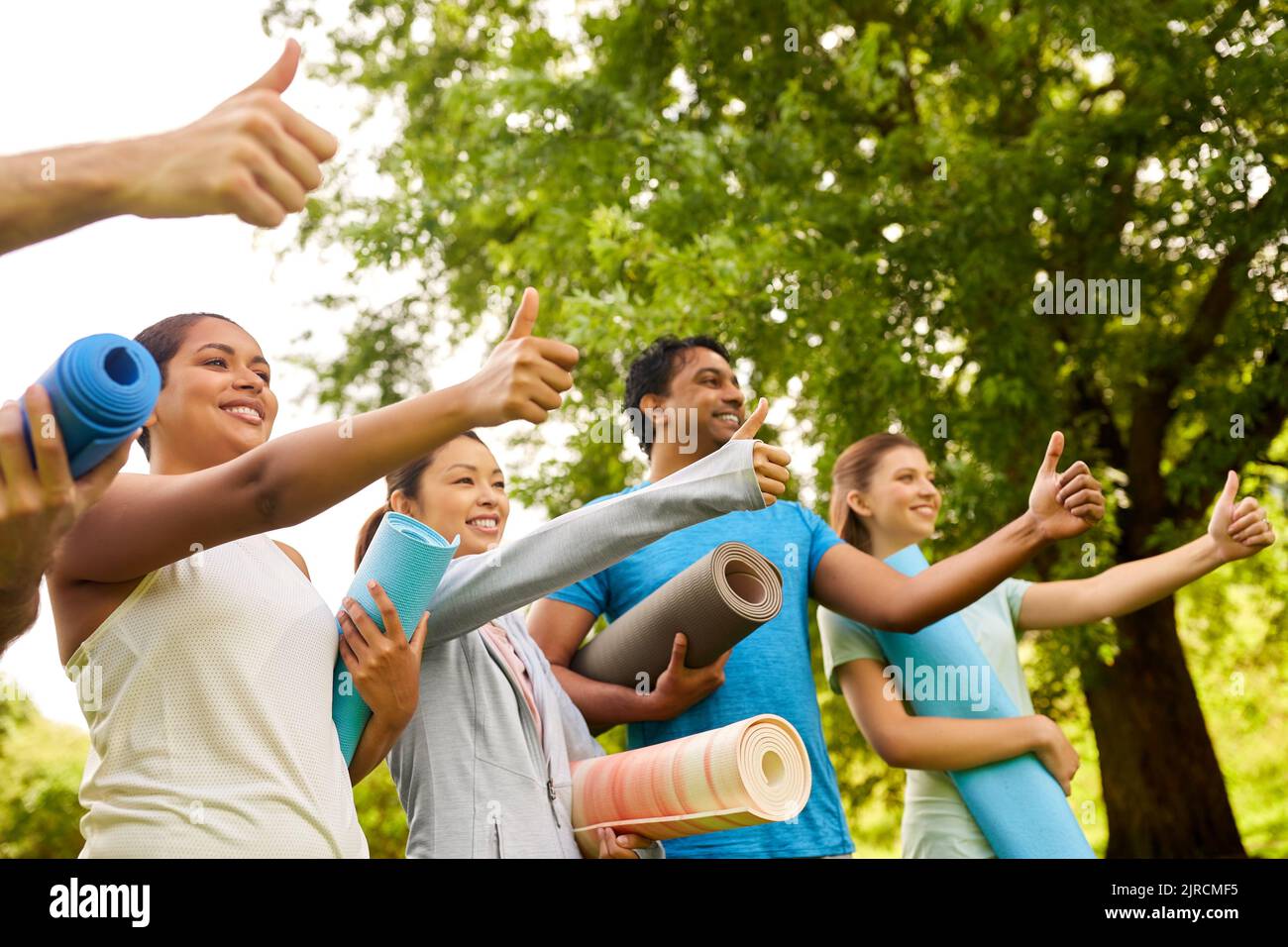 Happy friends yoga mats hi-res stock photography and images - Alamy