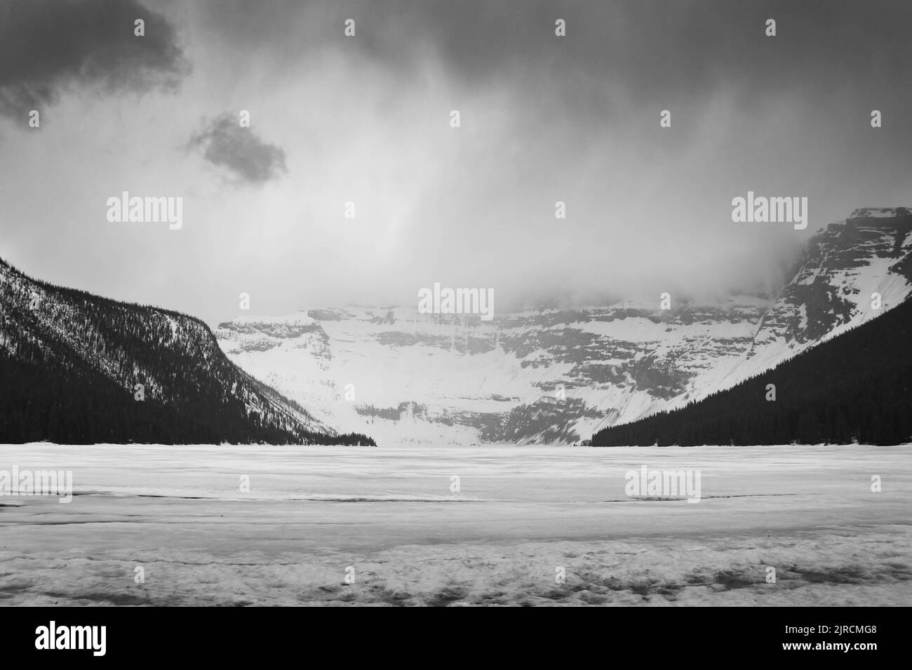 dramatic view of Cameron lake under cloudy sky in Waterton National ...