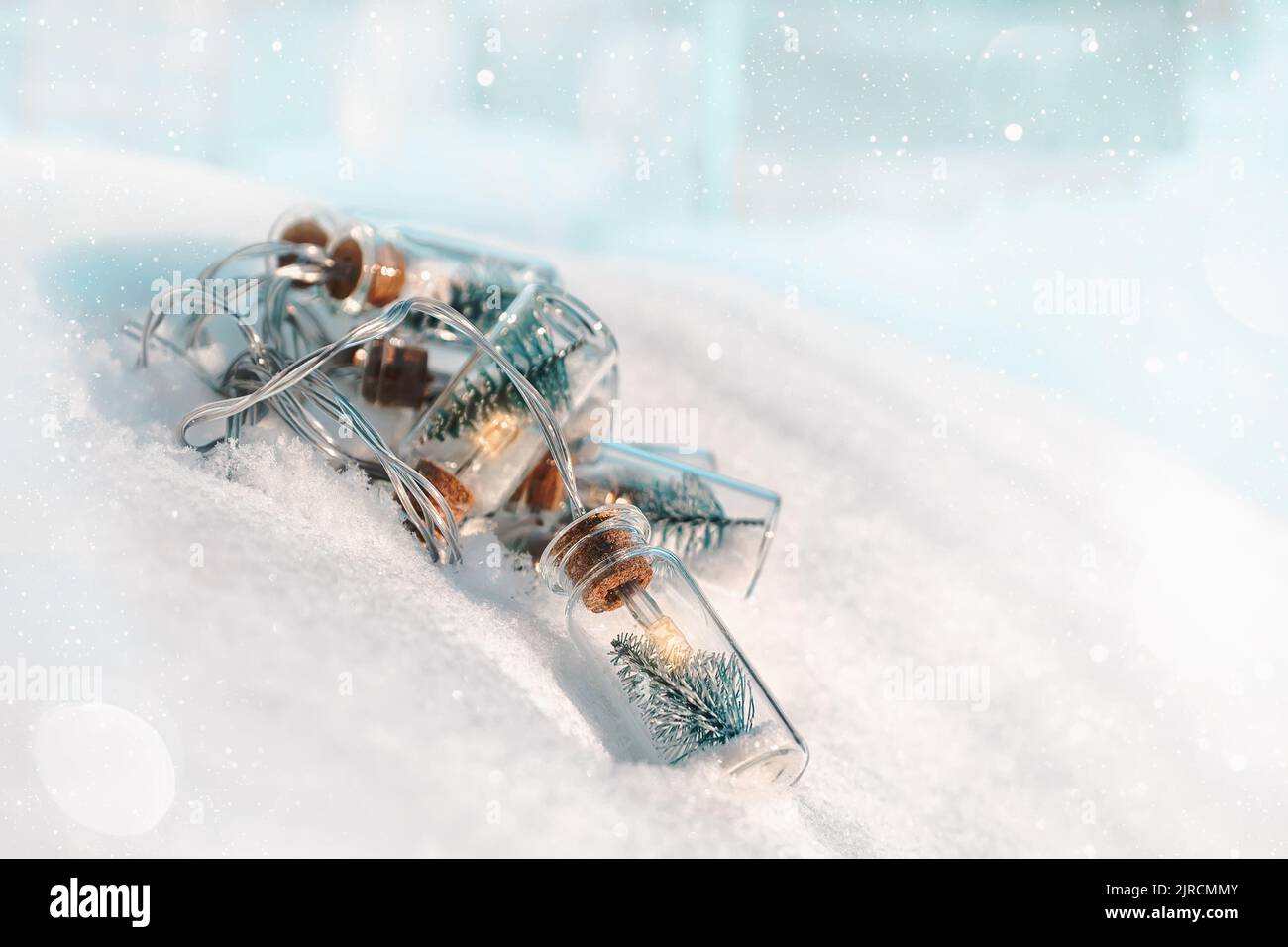Christmas tree garland in the form of glass flasks with Christmas trees ...
