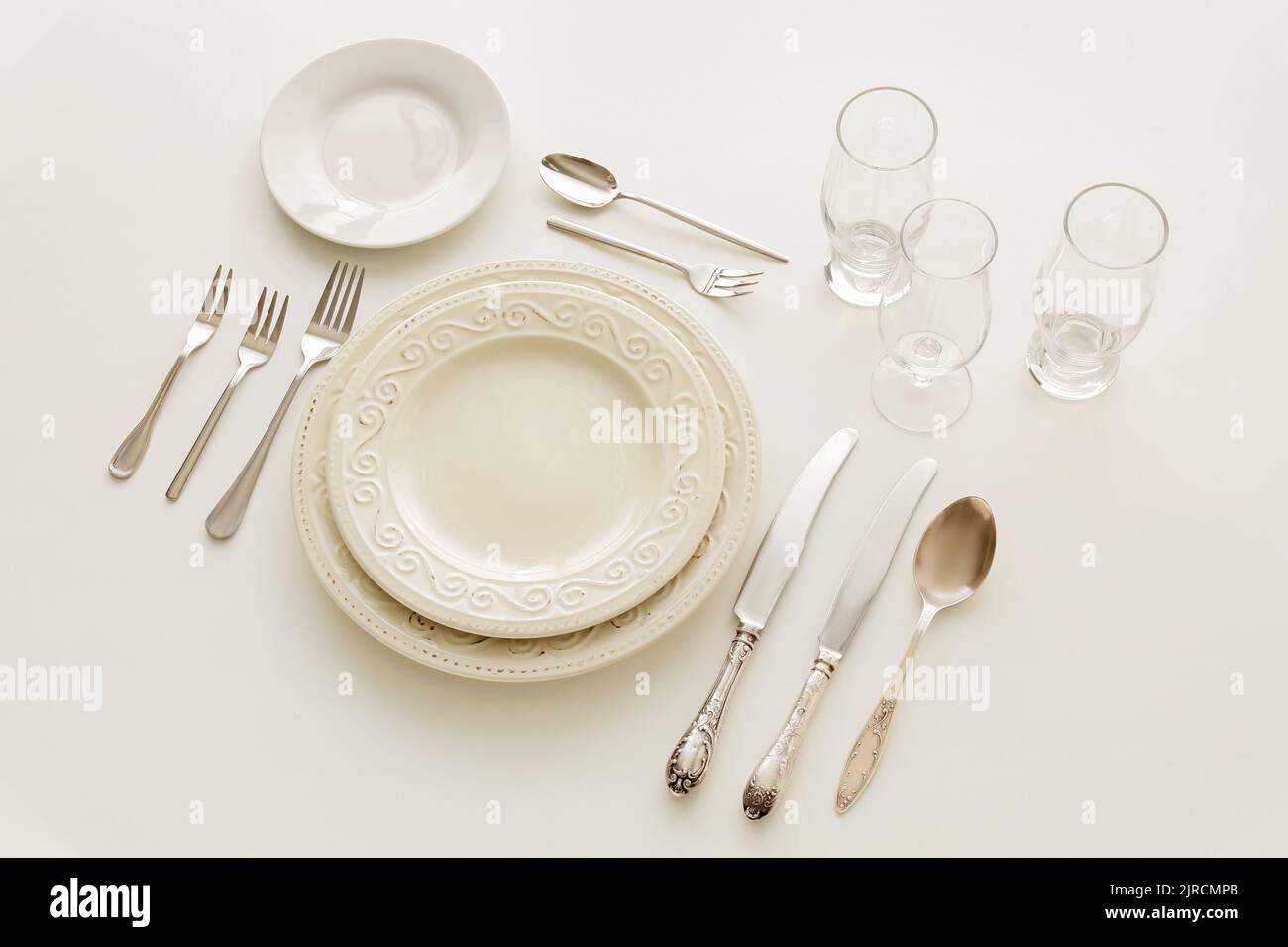 Set of stylish tableware on white background Stock Photo - Alamy