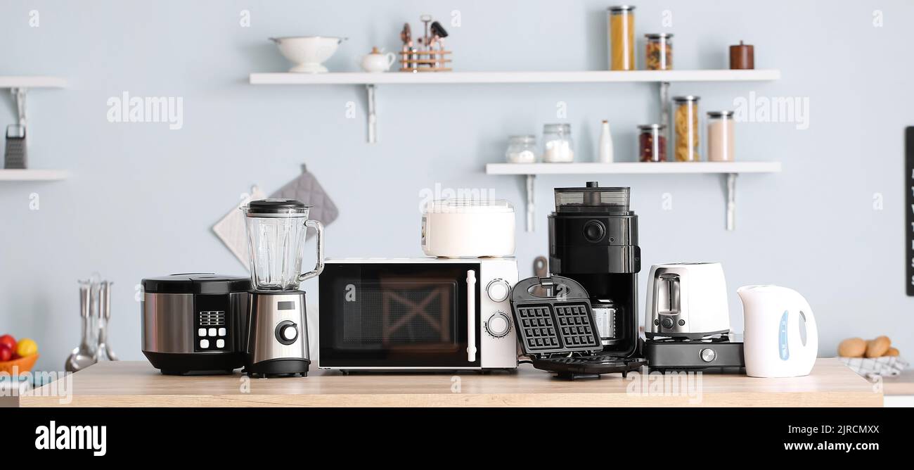 Different household appliances in kitchen Stock Photo - Alamy
