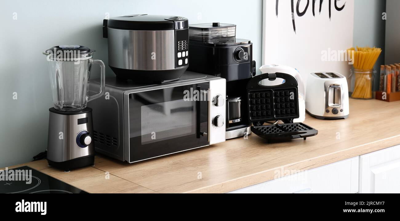 Different household appliances in kitchen Stock Photo - Alamy