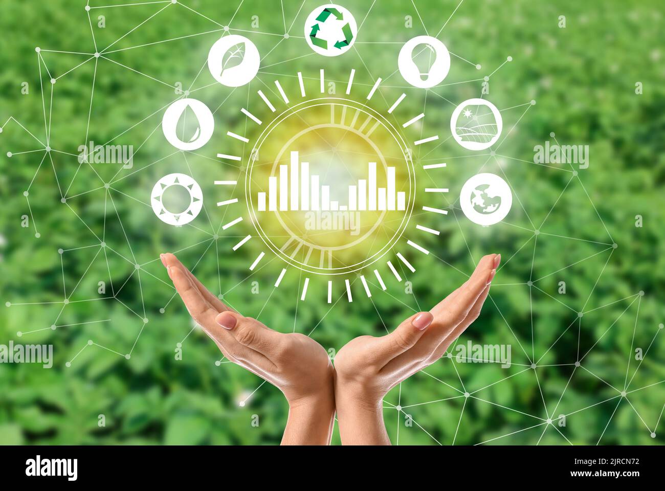 Female hands with digital icons and recycling symbol on blurred green ...