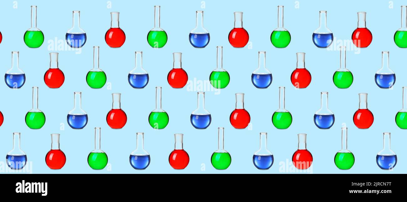 Many laboratory flasks on light blue background. Pattern for design ...