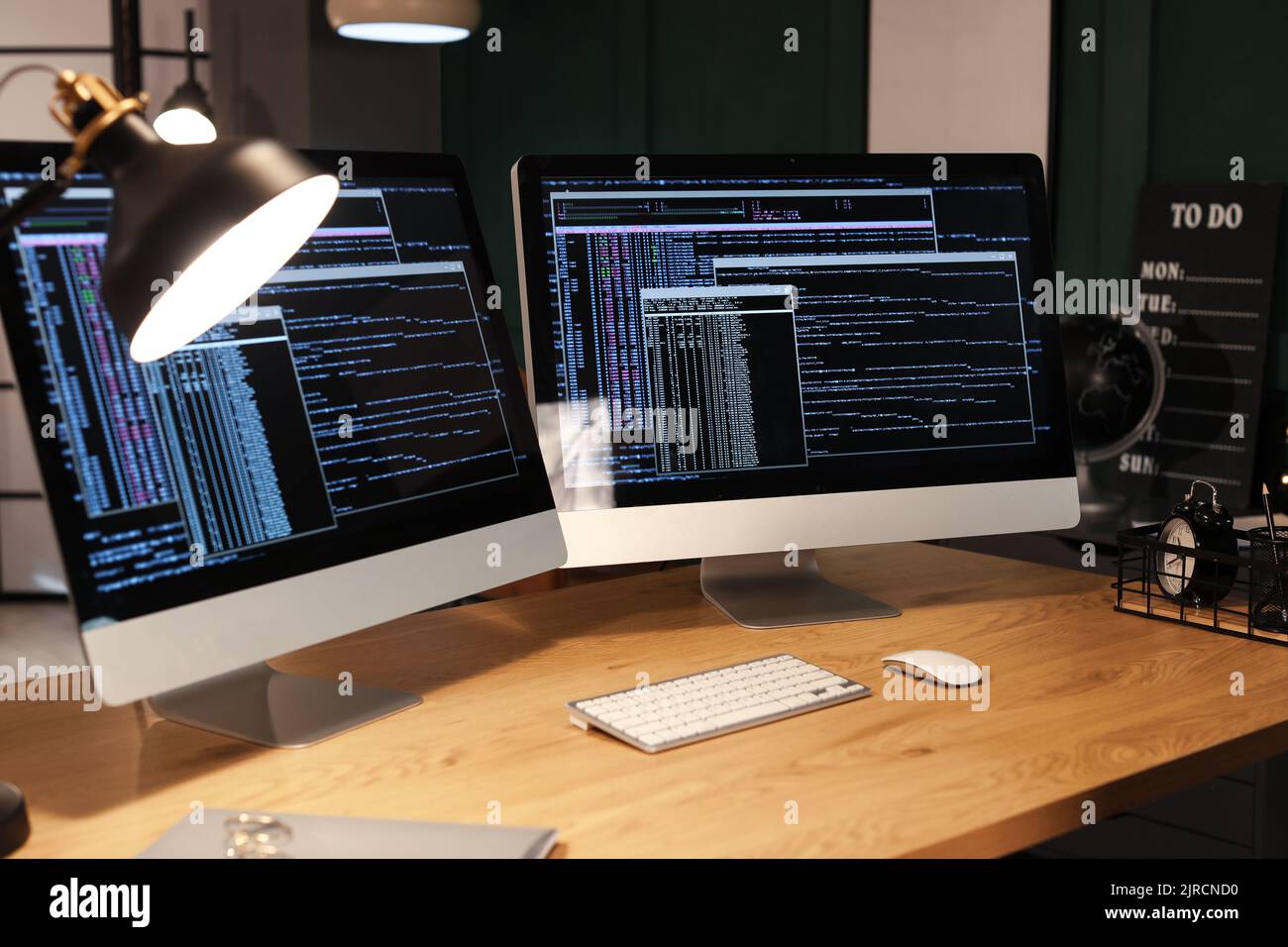 Modern workplace of programmer with computers Stock Photo - Alamy