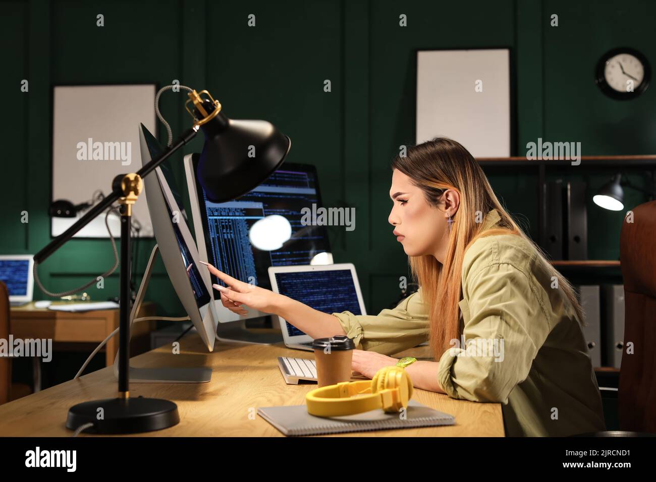 Transgender programmer working in server room Stock Photo - Alamy