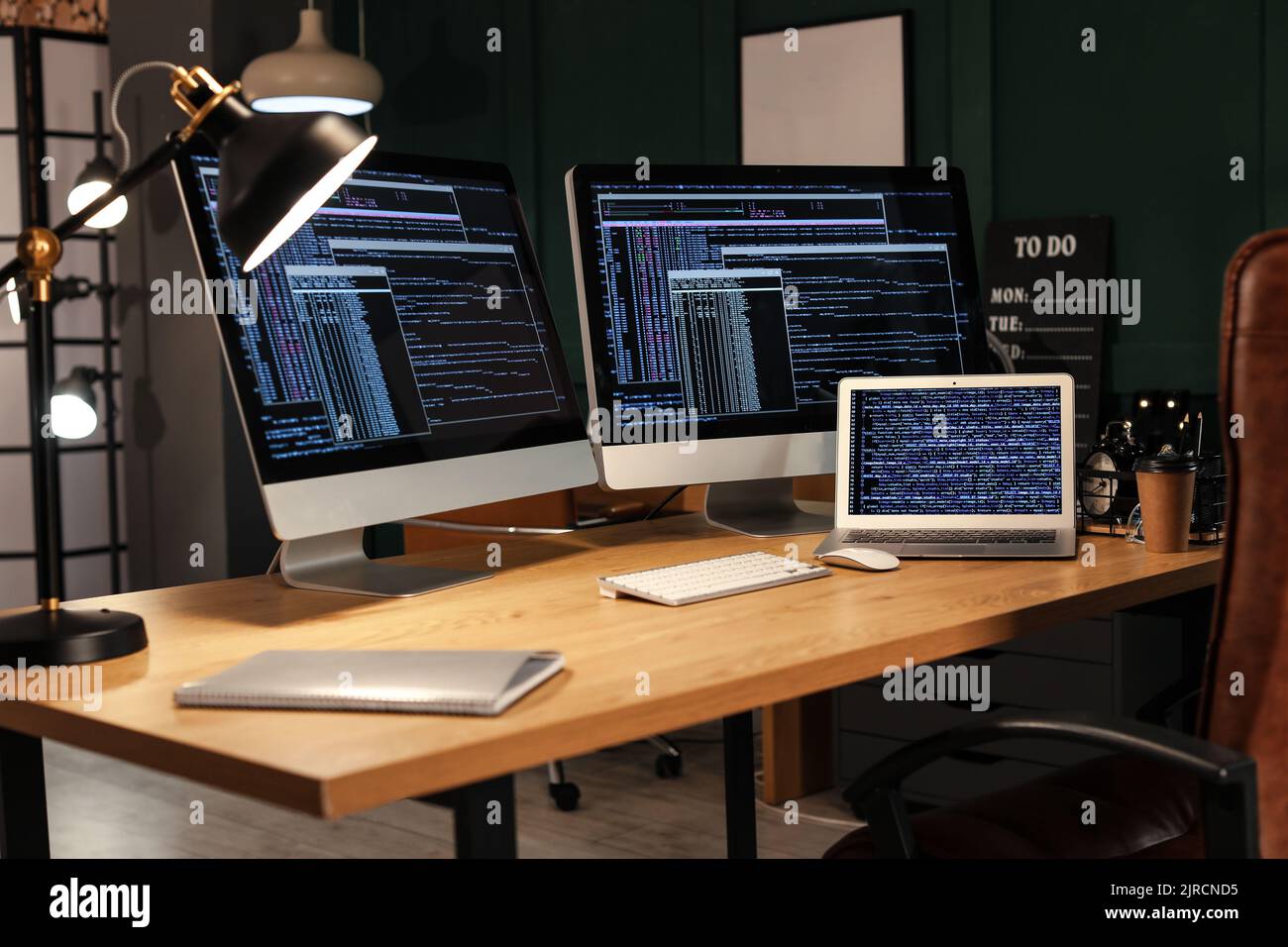 Modern workplace of programmer with computers Stock Photo - Alamy