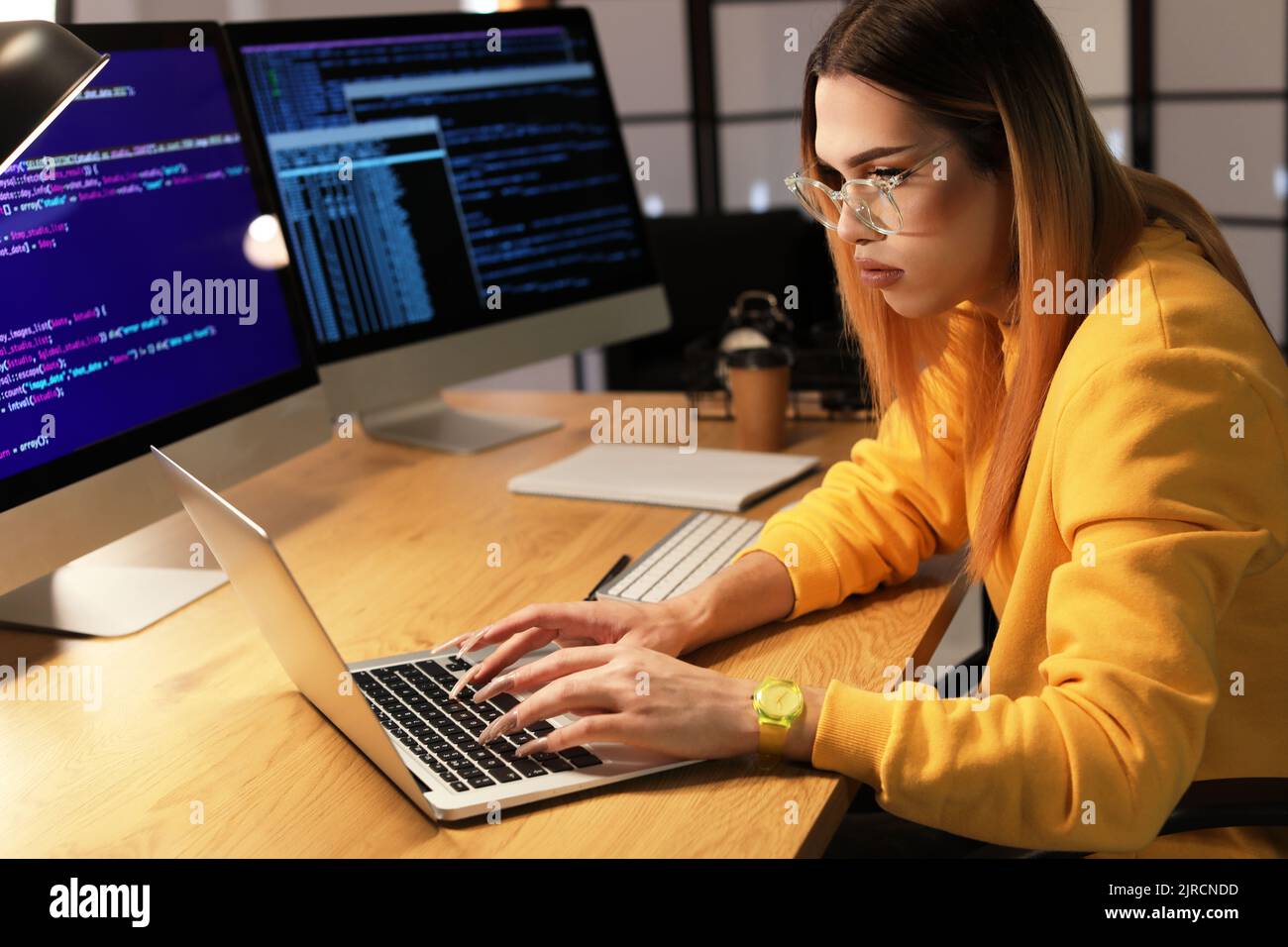Transgender programmer working in server room Stock Photo - Alamy