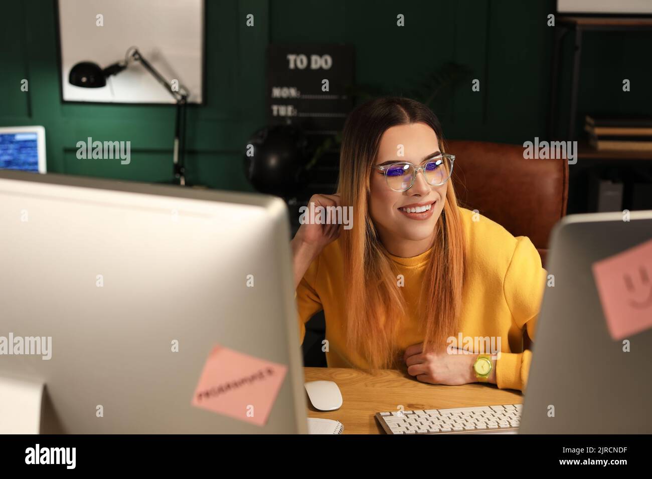 Transgender programmer working in server room Stock Photo - Alamy