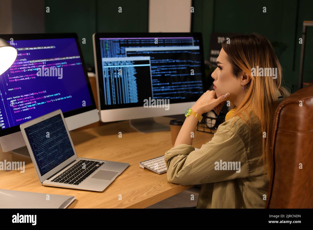 Transgender programmer working in server room Stock Photo - Alamy