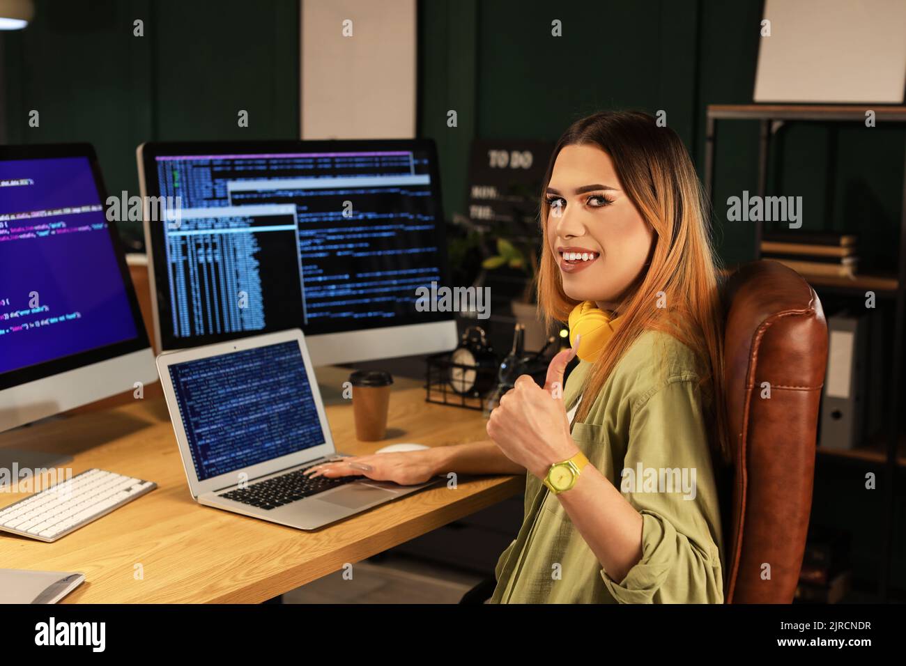 Transgender programmer working in server room Stock Photo - Alamy