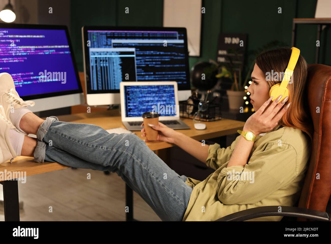 Transgender programmer working in server room Stock Photo - Alamy