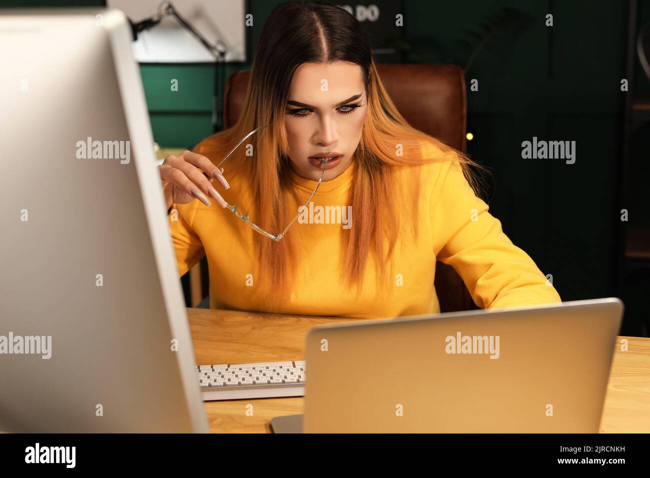 Transgender programmer working in server room Stock Photo - Alamy