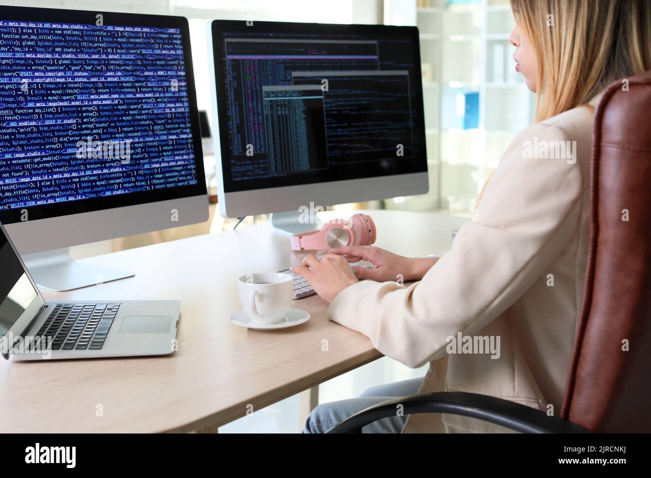 Transgender programmer working in office Stock Photo - Alamy