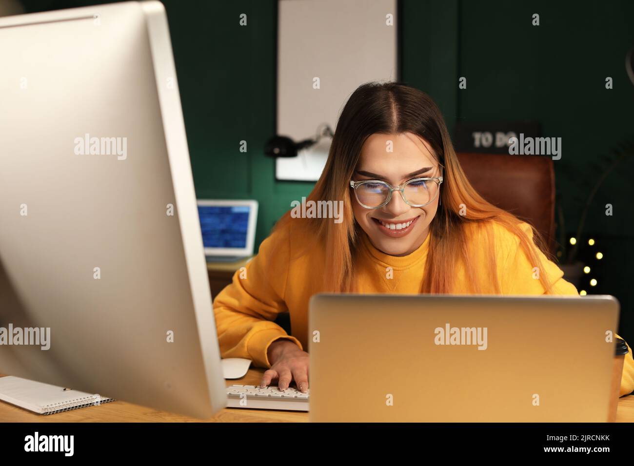 Transgender programmer working in server room Stock Photo - Alamy