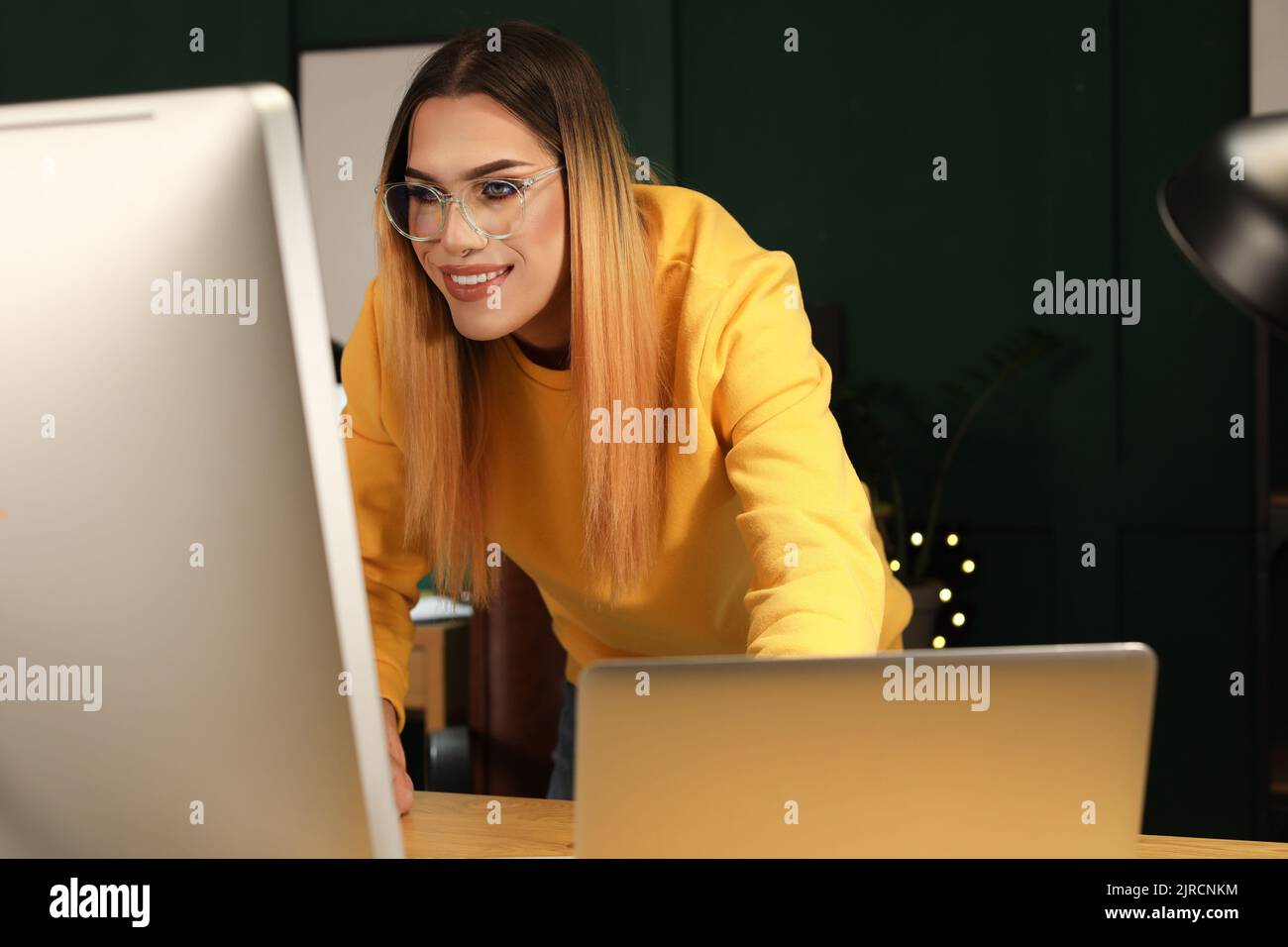 Transgender programmer working in server room Stock Photo - Alamy