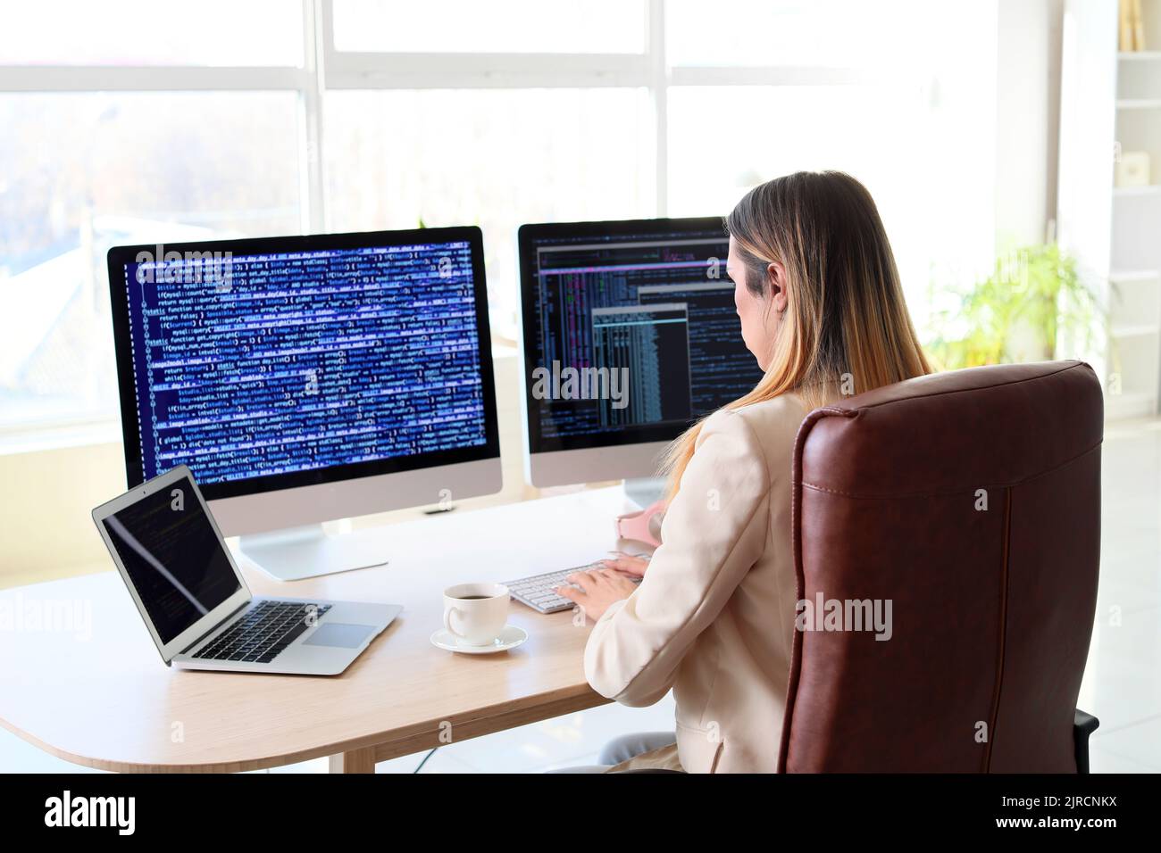 Transgender programmer working in office Stock Photo - Alamy