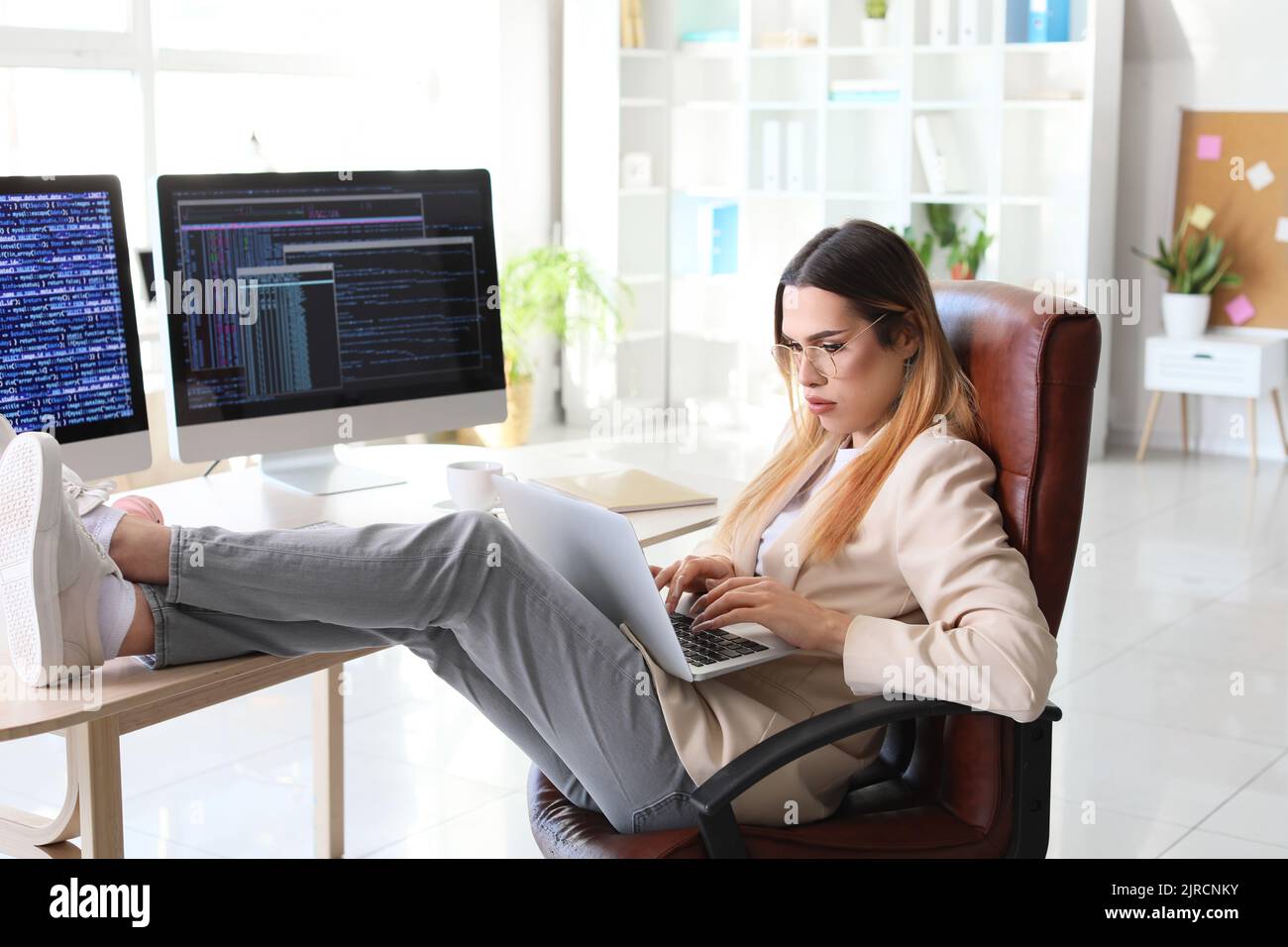 Transgender programmer working in office Stock Photo - Alamy
