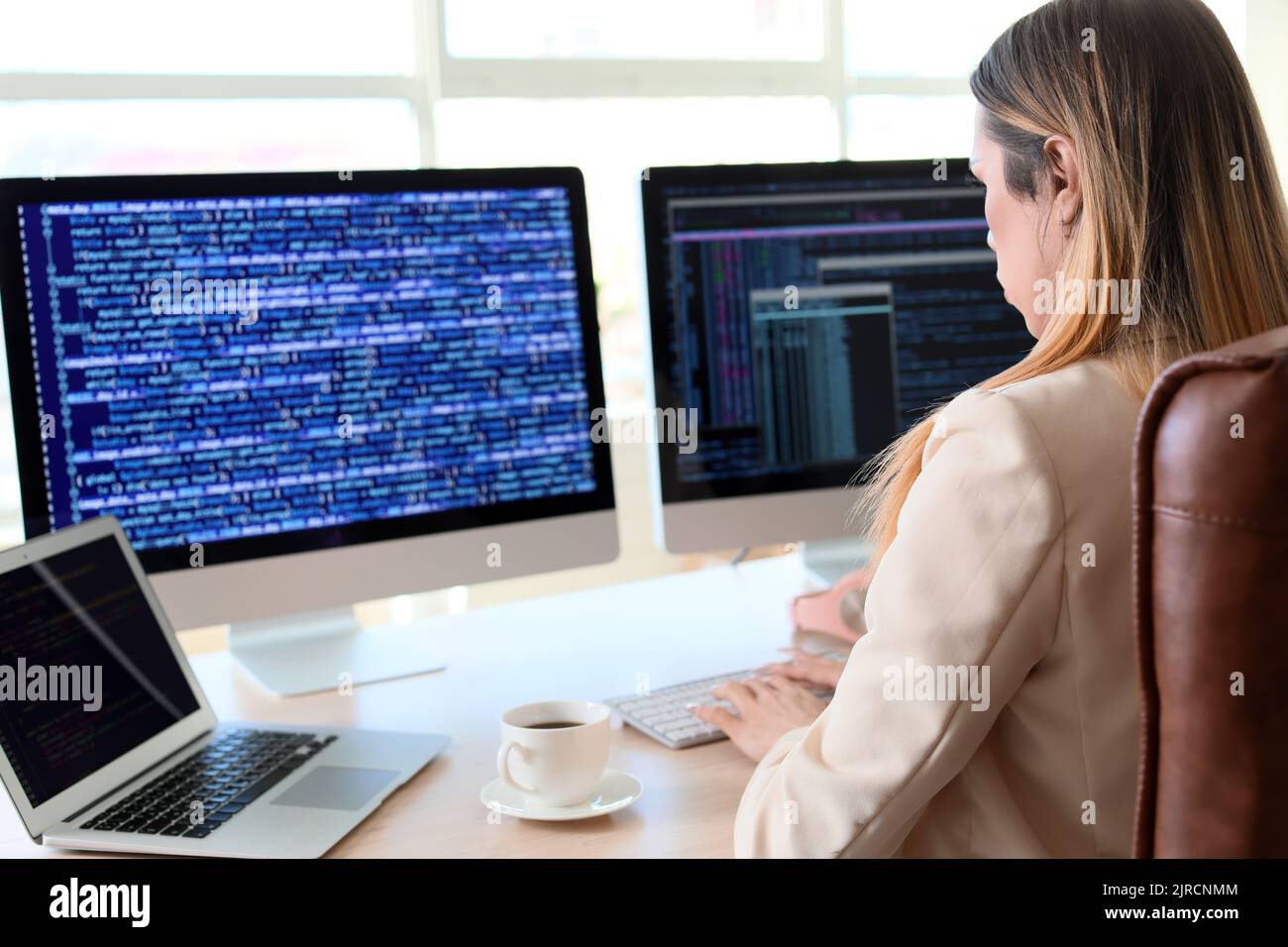 Transgender programmer working in office Stock Photo - Alamy