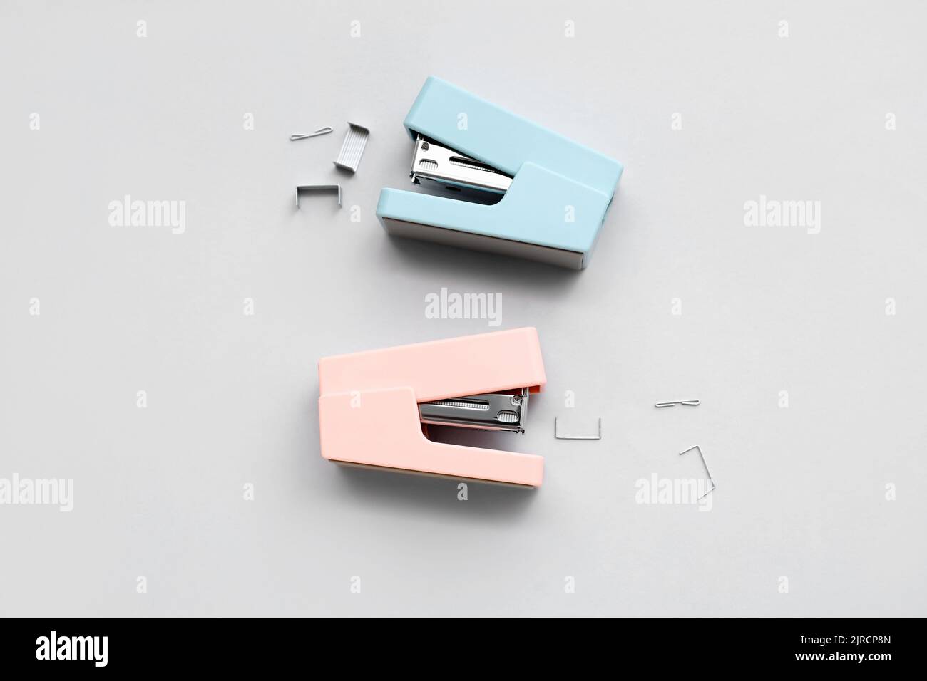 Office staplers with staples on white background Stock Photo - Alamy