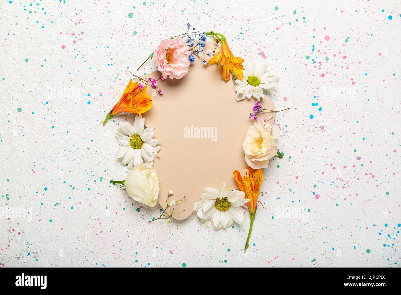 Decorative stand with frame made of beautiful flowers on light ...