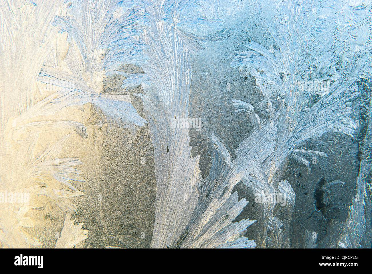 Frozen winter window with shiny ice frost pattern texture. Christmas ...