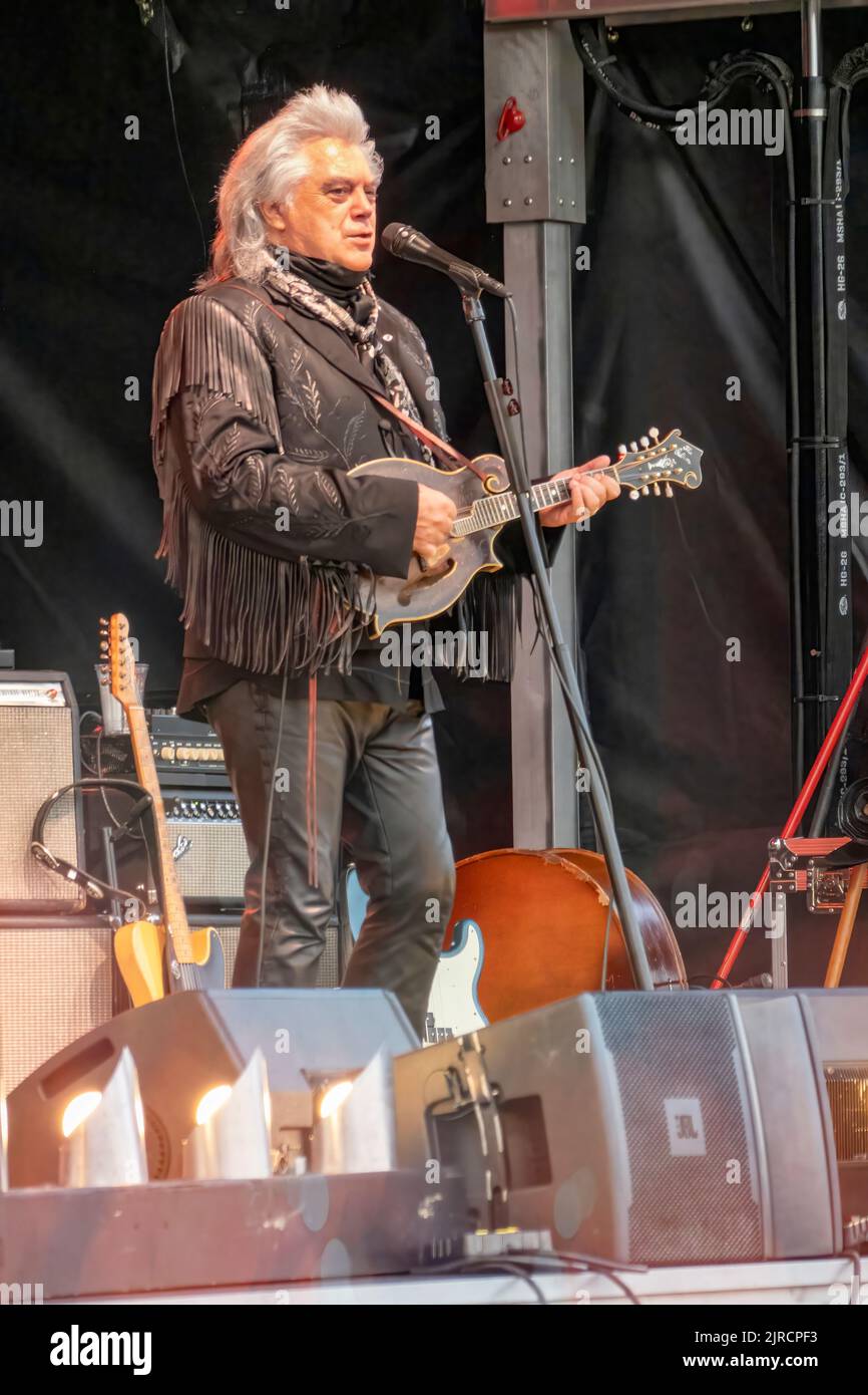 Marty Stuart performing live in an outdoor concert, part of An ...