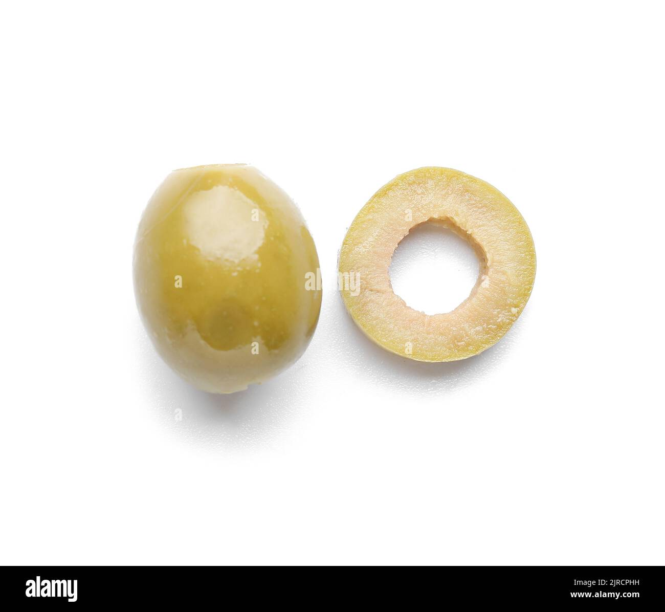 Tasty green olive and slice on white background Stock Photo - Alamy