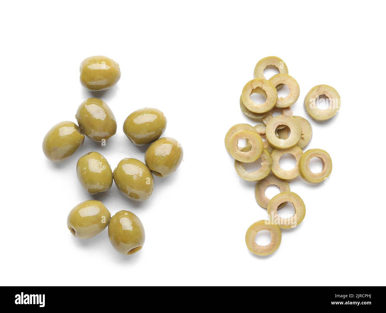 Whole and cut green olives on white background Stock Photo - Alamy