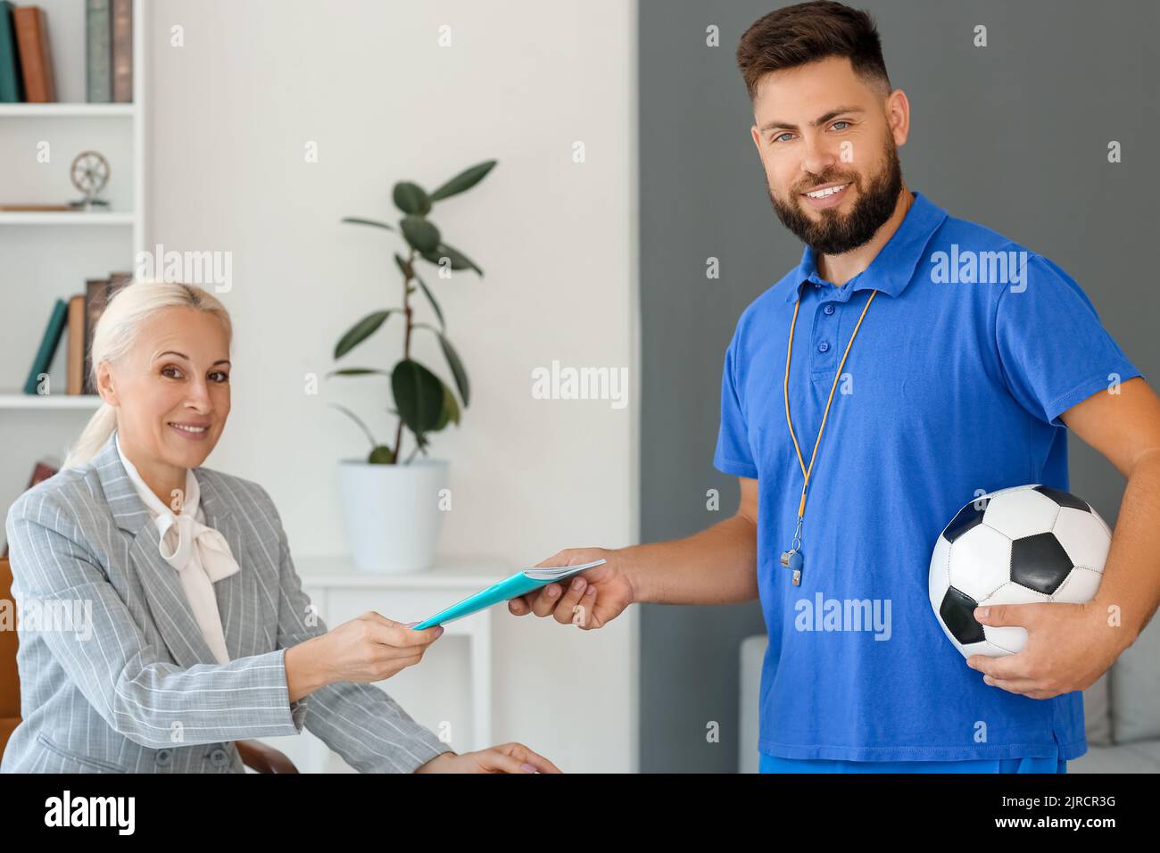 Teachers working in school office Stock Photo - Alamy