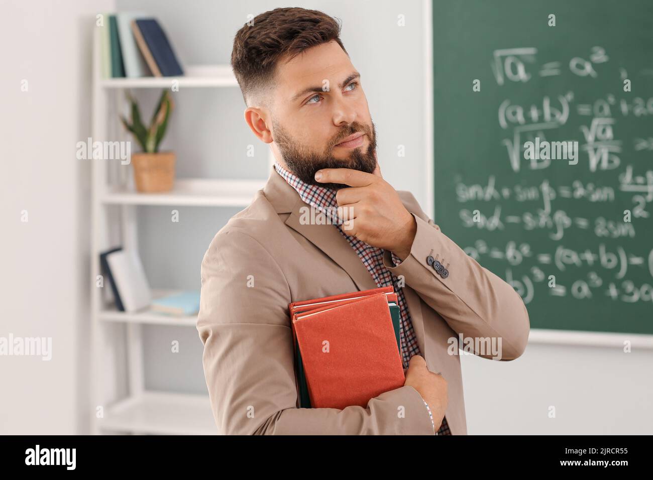 Math teacher conducting lesson hi-res stock photography and images - Alamy
