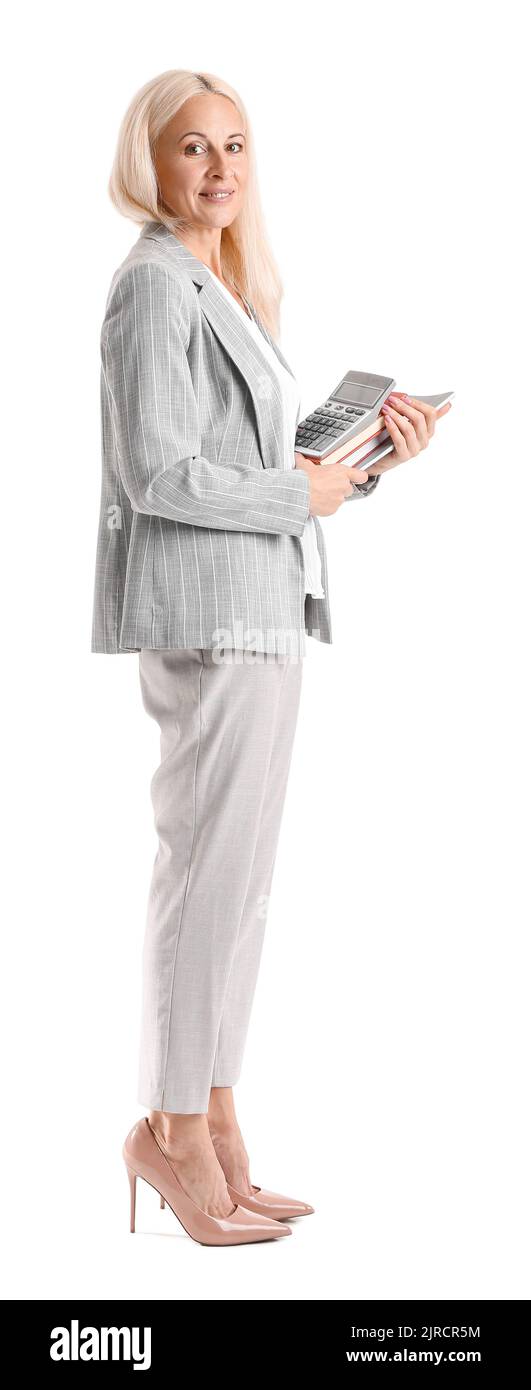 Mature Math teacher with calculator and books on white background Stock ...