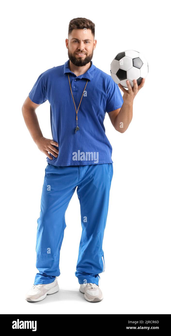 Handsome PE teacher with ball on white background Stock Photo - Alamy