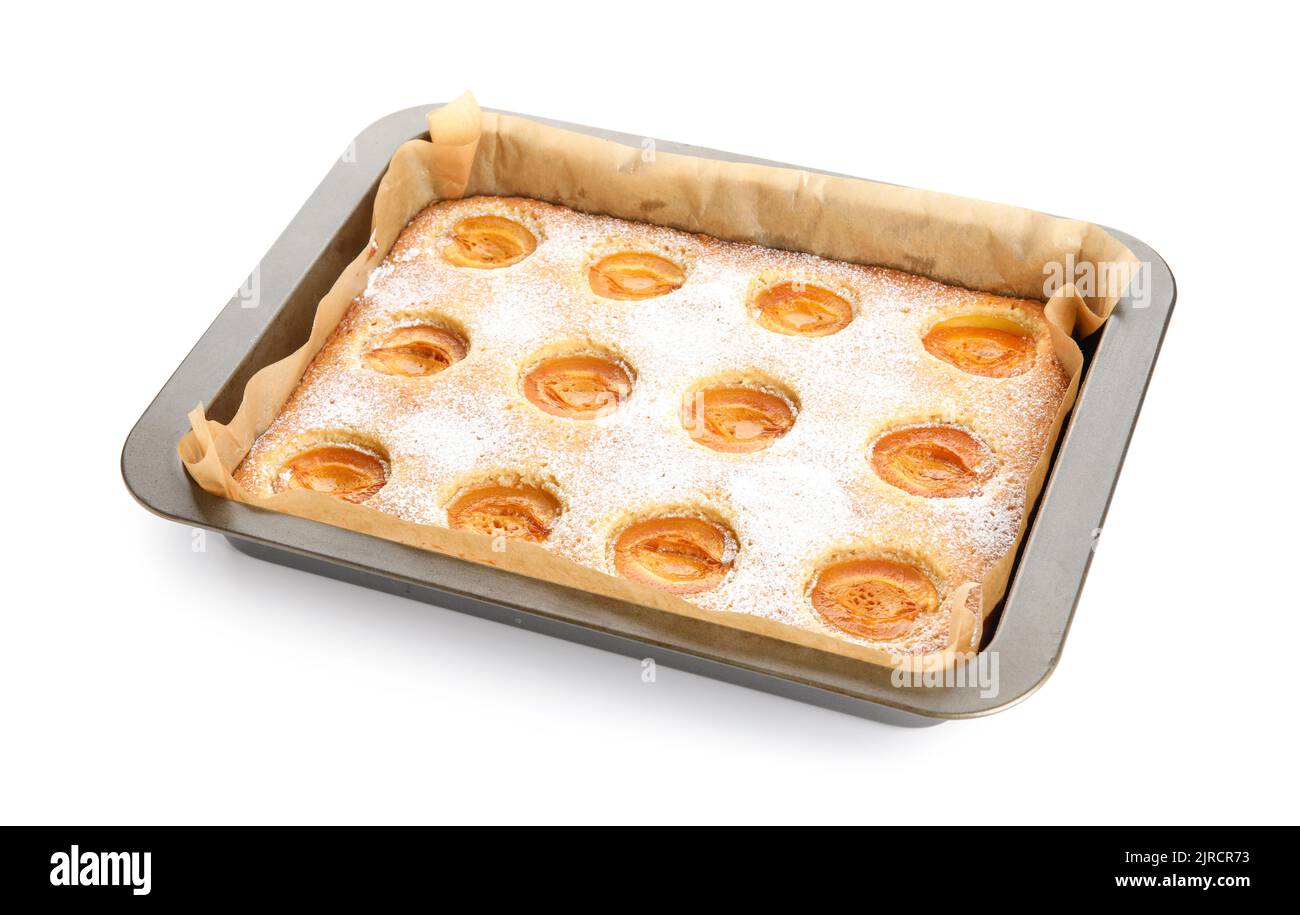Baking tray with tasty apricot pie on white background Stock Photo - Alamy
