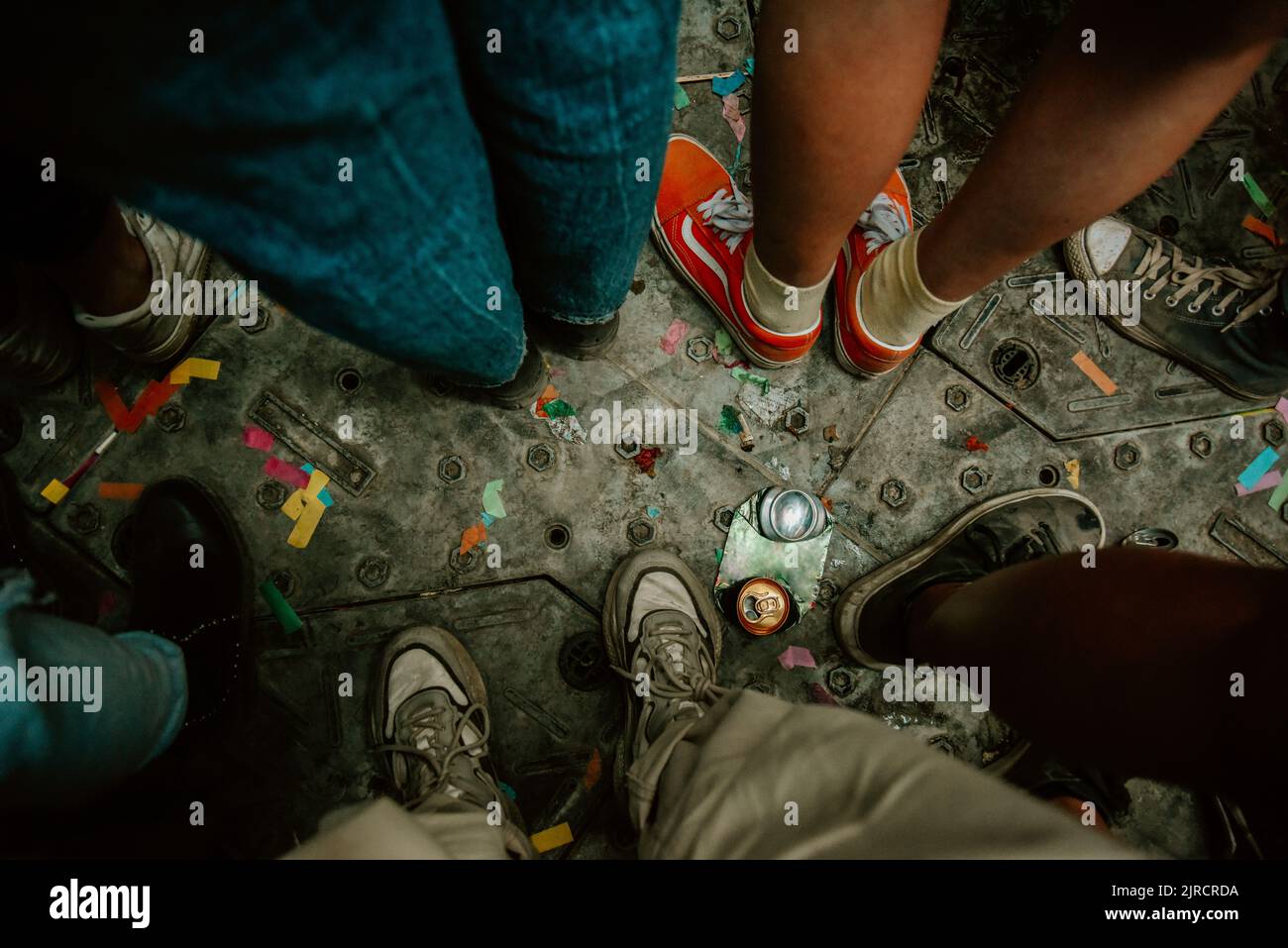 Photo of legs and floor at the festival. Crowd shoes, panic attack ...