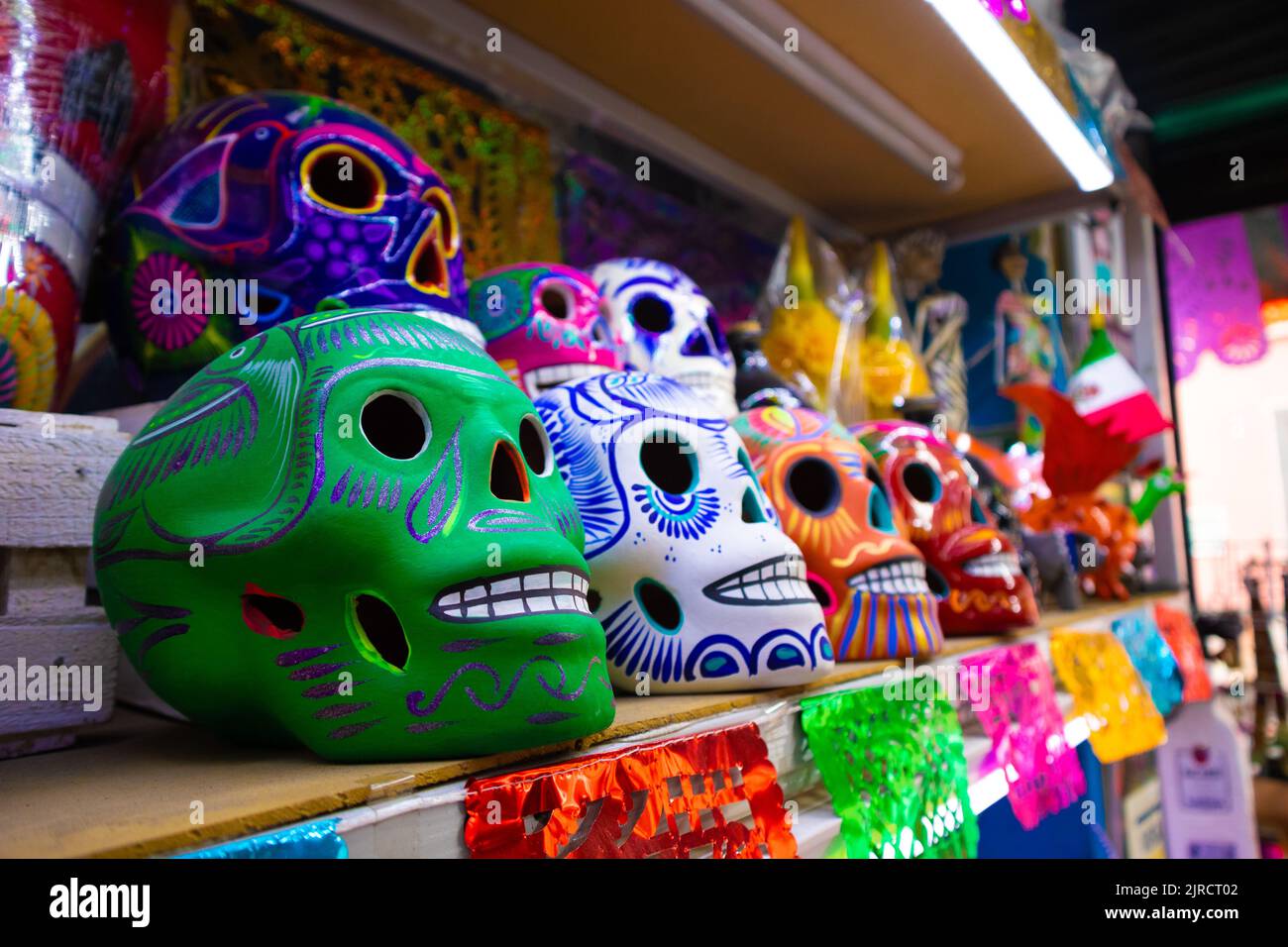 green talavera pottery skull Mexican colorful skulls in a market ...
