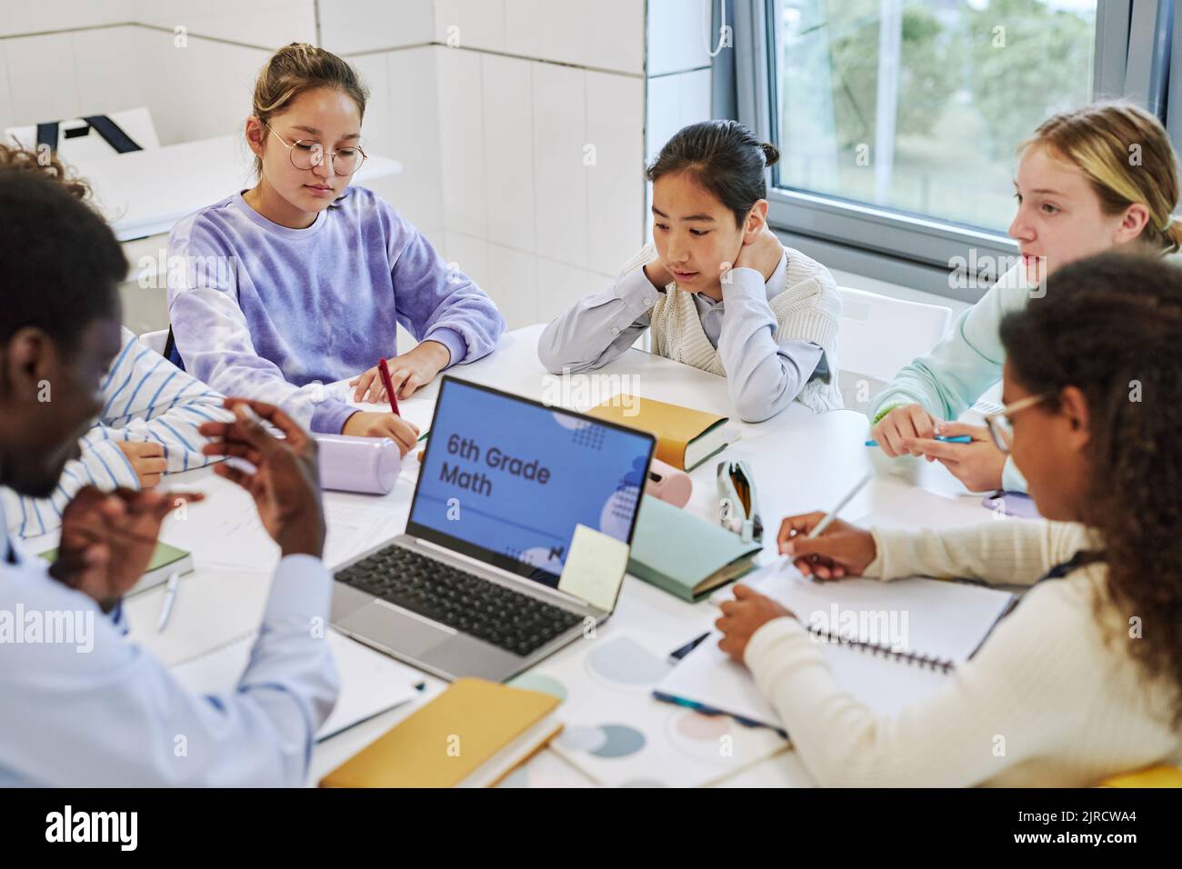 Teen boy girl sitting classroom talking hi-res stock photography and ...