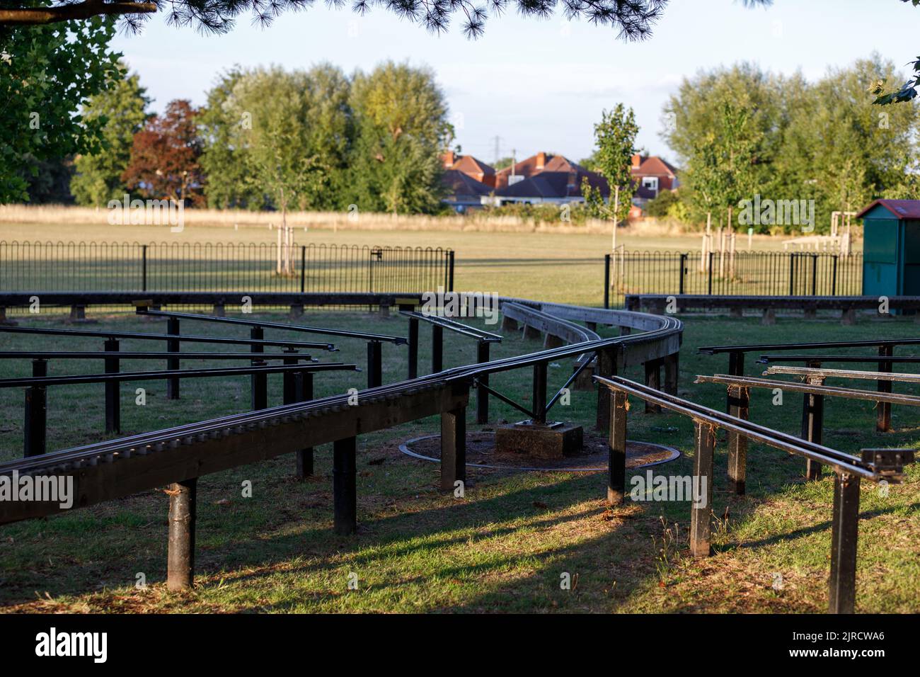 A miniature railway track steaming bays and turntable in a green park ...