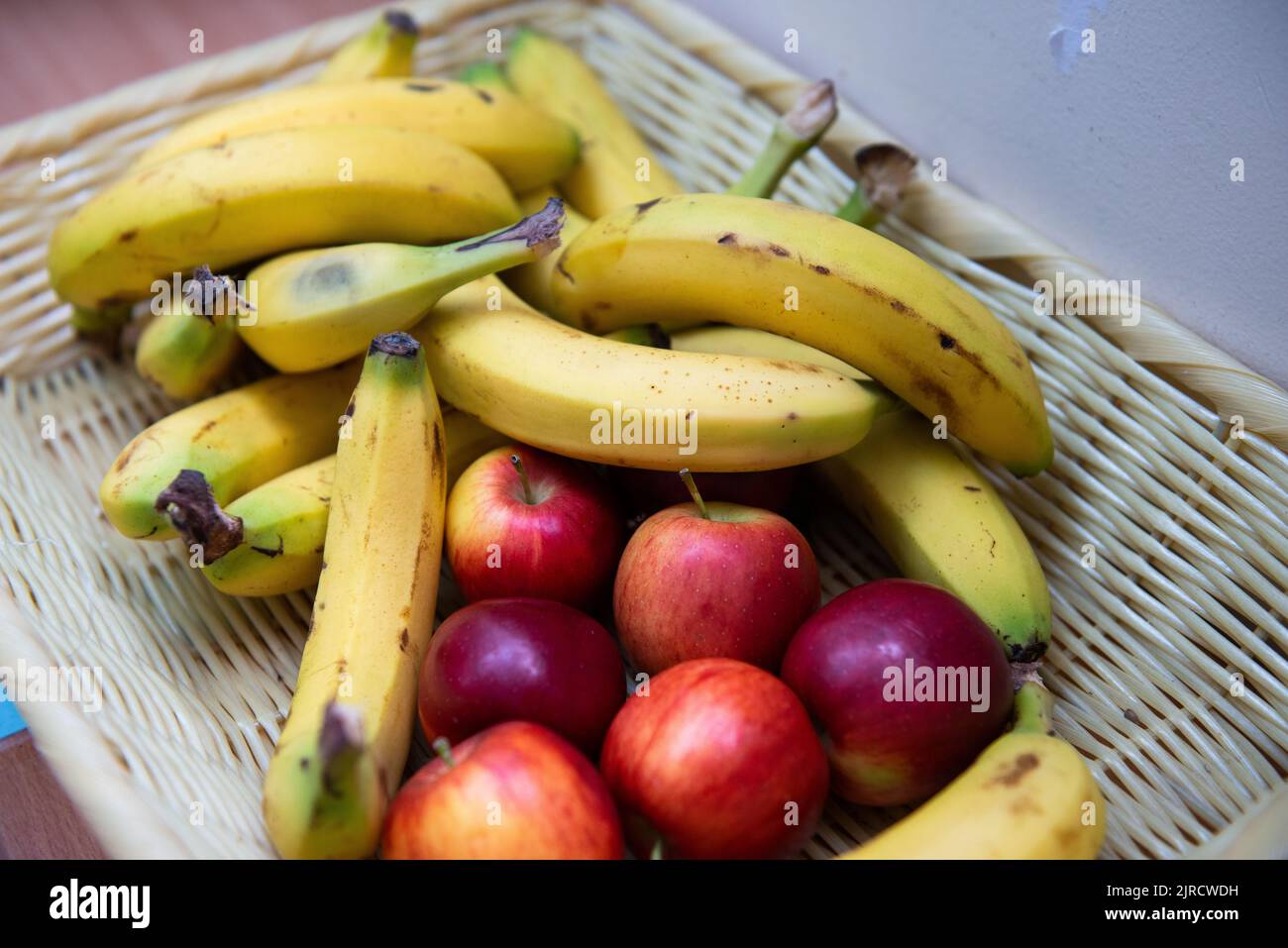 Basket of apples and bananas Stock Photo - Alamy