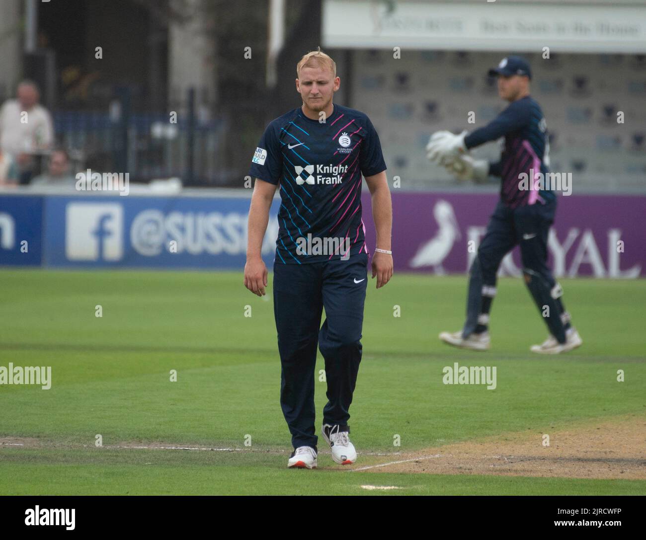 Max Harris walks back to his mark against Sussex at the Hove County ...