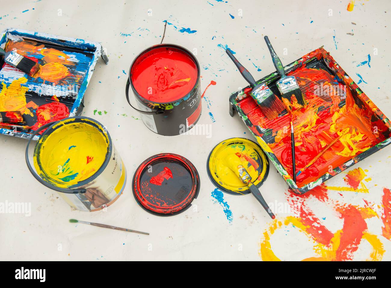 paint cans and brushes in classroom Stock Photo - Alamy