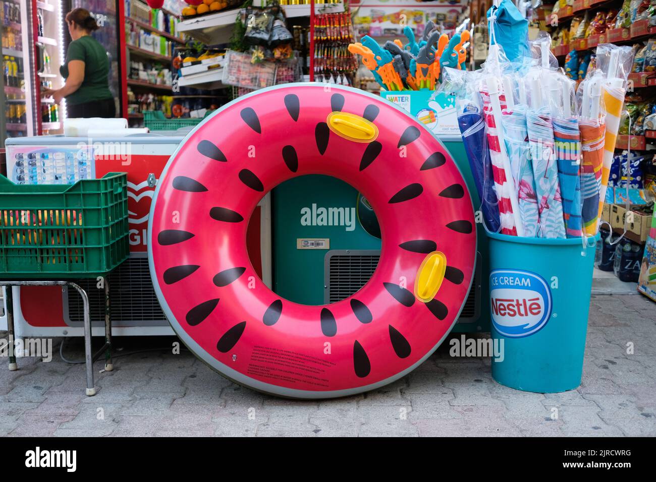 Inflatable rubber ring watermelon outside a grocery store in the street ...