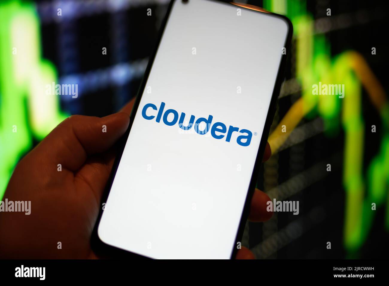 The Cloudera logo is seen on a Redmi phone screen in this photo ...
