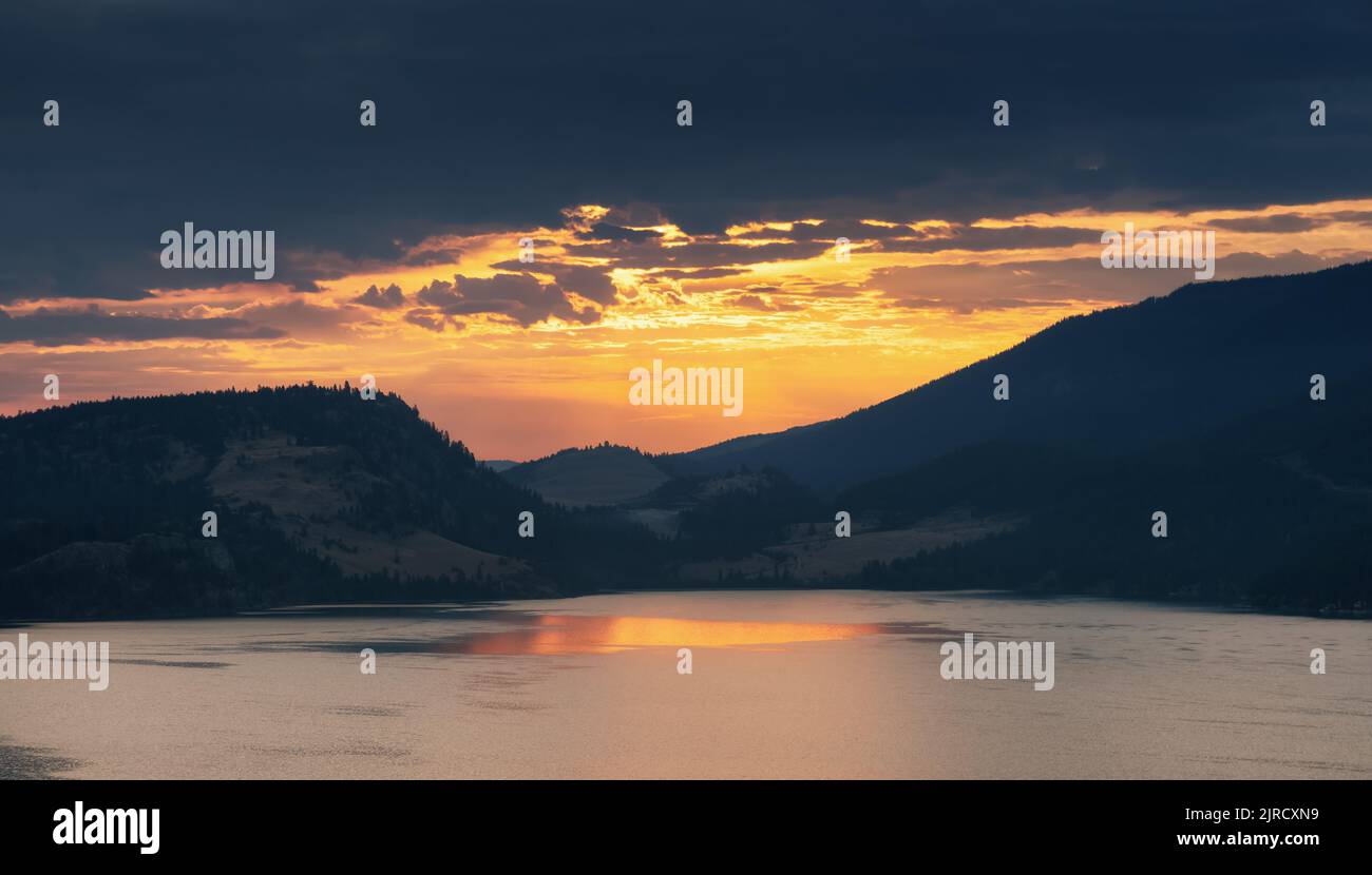 Dramatic Cloudy Sunrise in the desert landscape with mountains by the ...