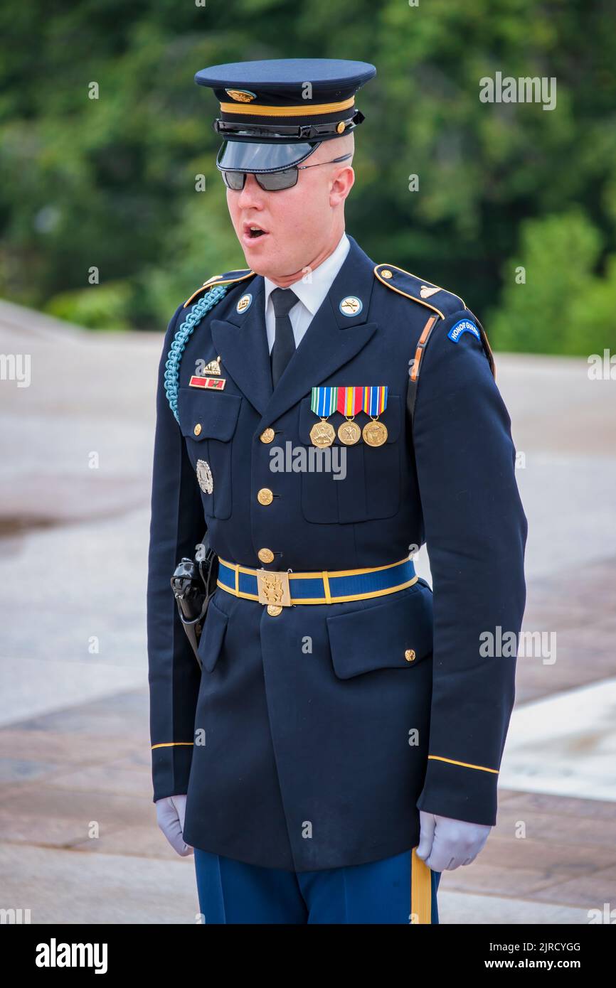 An officer issues orders during the changing of the Honor Guard ...